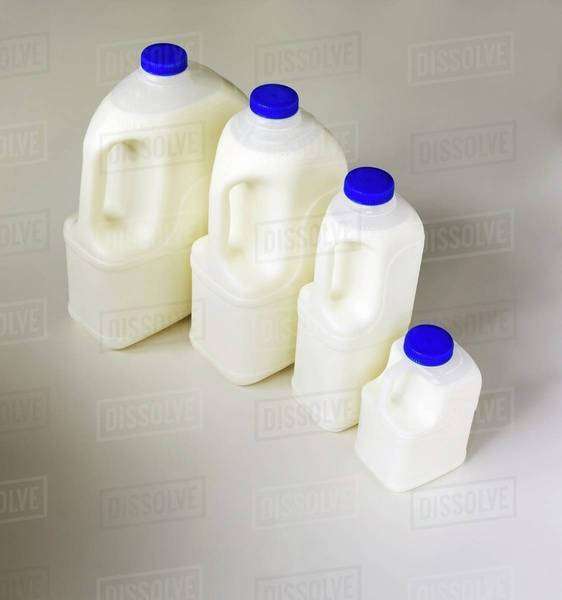 Milk in various plastic bottles - Royalty-free Stock Photo | Dissolve