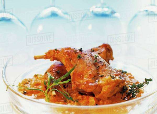 Two rabbit legs in mustard sauce with tarragon - Royalty-free Stock ...