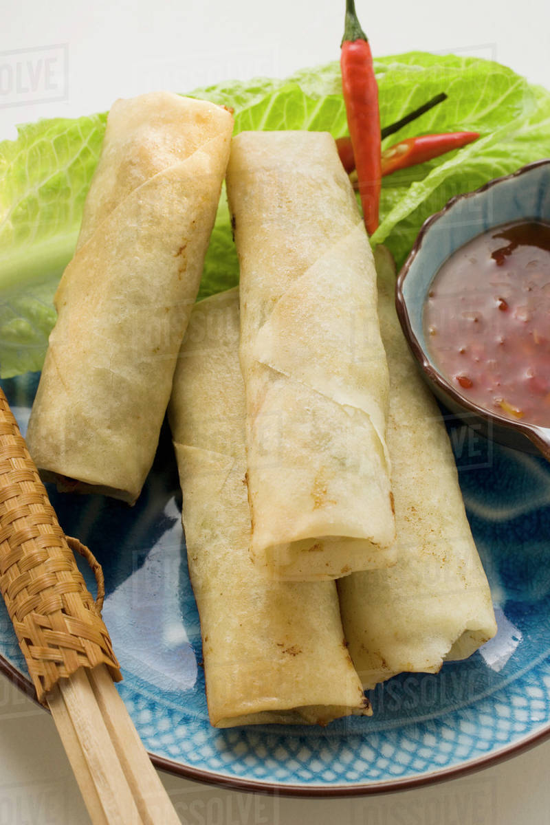 Spring rolls with chili dip - Stock Photo - Dissolve