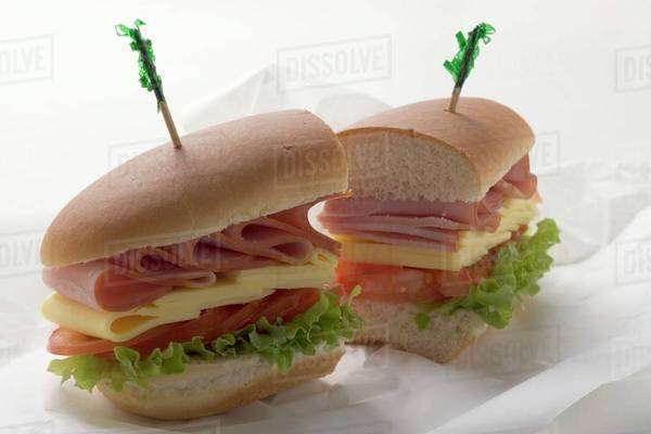 Sub sandwich, halved, on sandwich wrap - Royalty-free Stock Photo ...