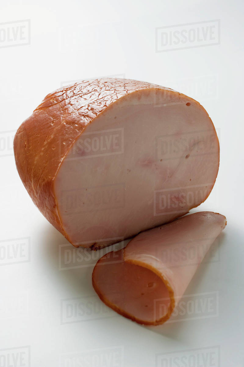 Turkey ham with a slice cut - Royalty-free Stock Photo | Dissolve