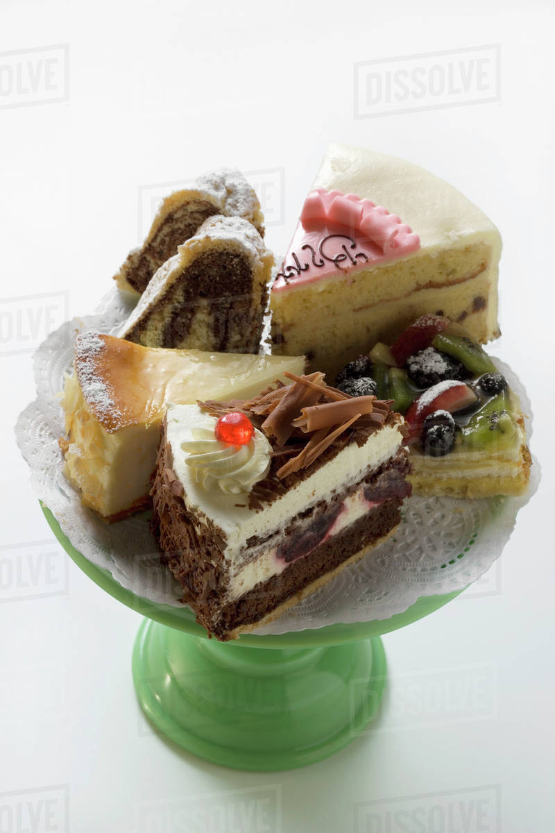 A selection of pieces of cake on cake stand - Stock Photo - Dissolve