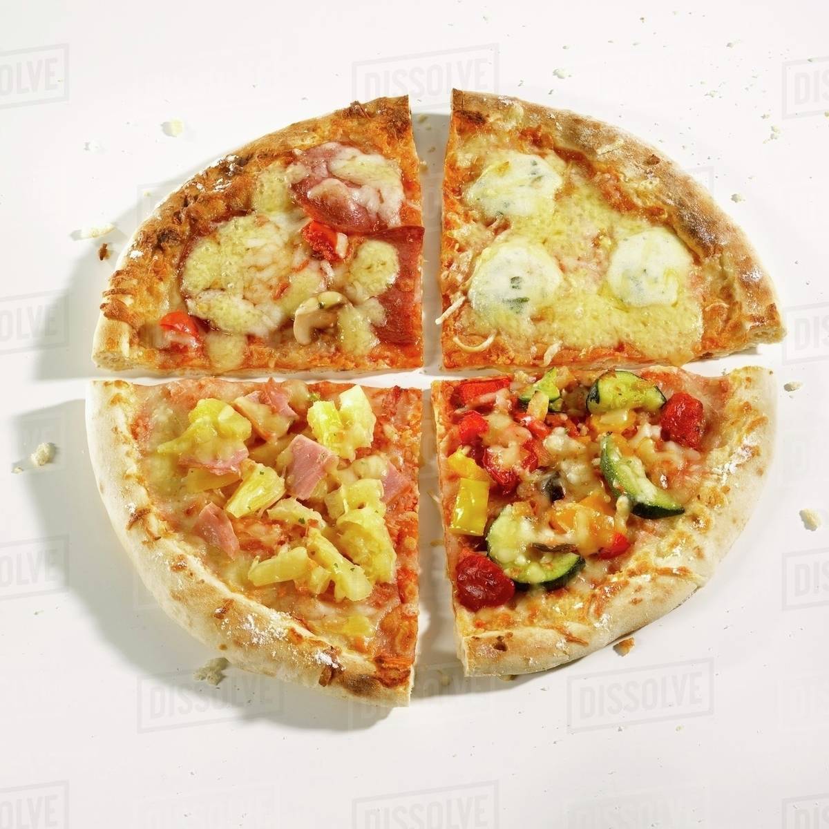 Quarters of four different pizzas - Stock Photo - Dissolve