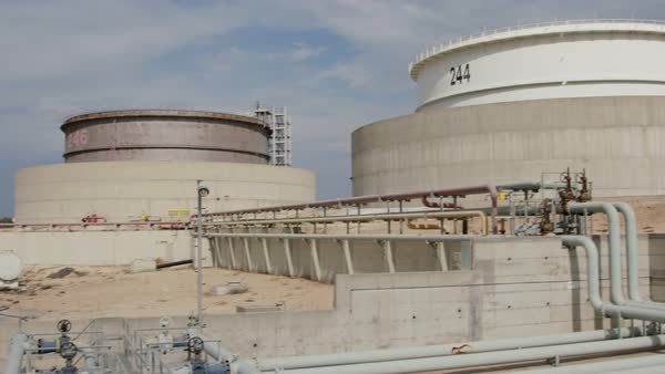 Large crude oil storage tanks in a huge refinery - 4K Royalty-free ...