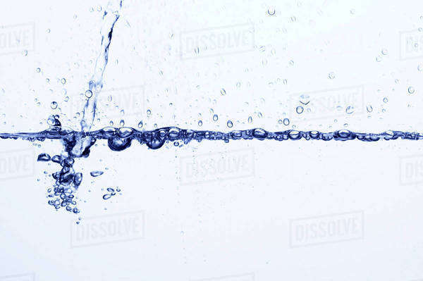 Pouring water, close-up - Stock Photo - Dissolve