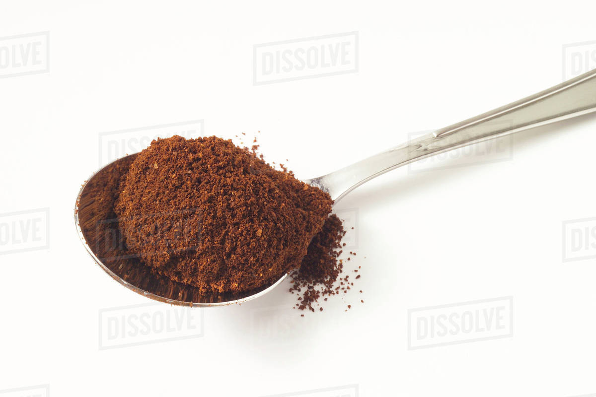 Coffee powder on spoon - Stock Photo - Dissolve