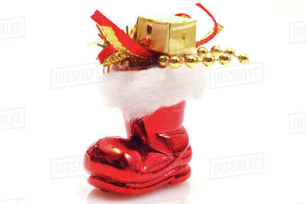 Santa Claus boot with gifts, close-up - Stock Photo - Dissolve