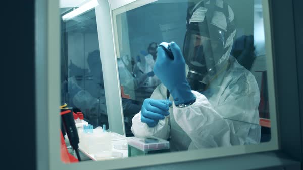 Covid-19, coronavirus concept. Lab expert is analyzing a chemical ...