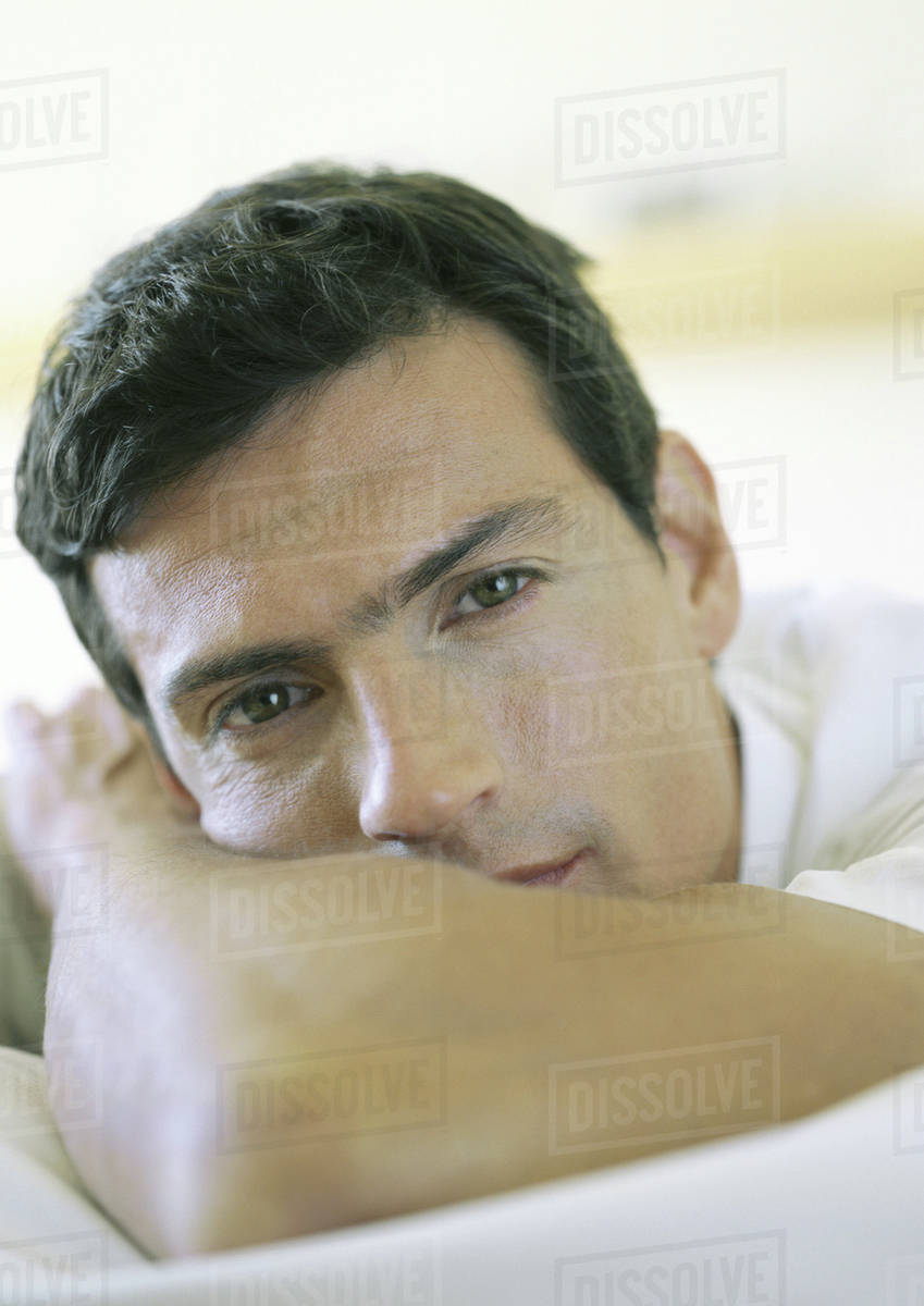 Man resting head on arm - Royalty-free Stock Photo | Dissolve