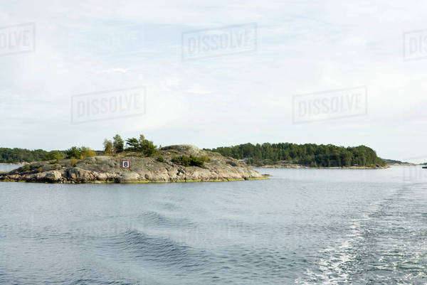 Rocky island in lake - Royalty-free Stock Photo | Dissolve