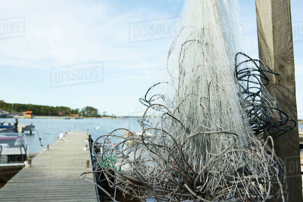 Tangled fishing nets on dock - Royalty-free Stock Photo | Dissolve