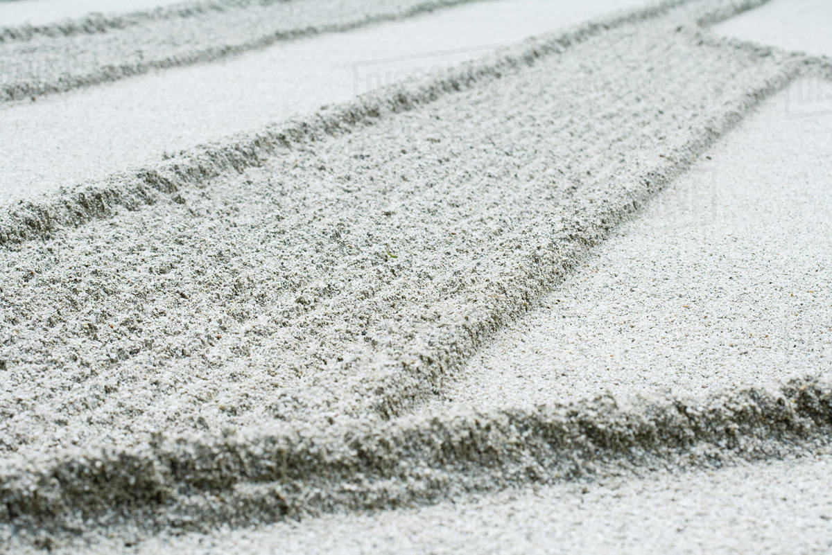 Patterns raked in gravel, close-up - Royalty-free Stock Photo | Dissolve