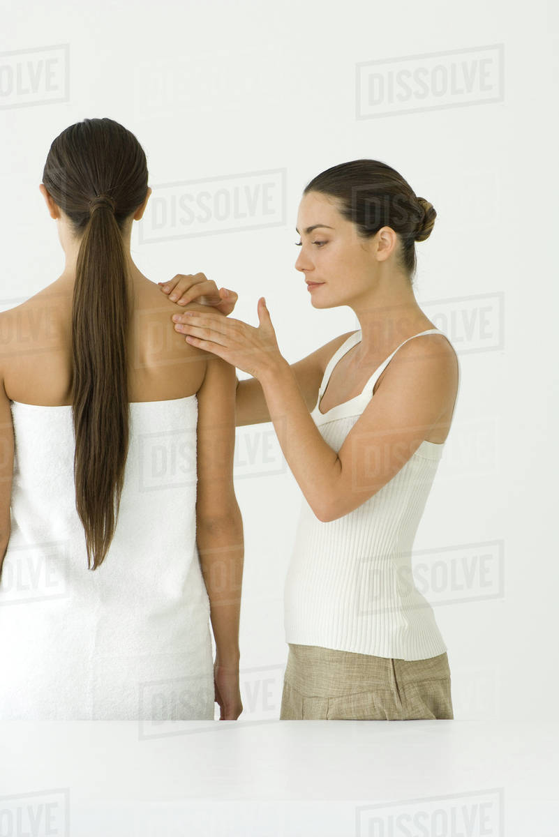 Woman receiving shoulder massage therapy - Royalty-free Stock Photo ...