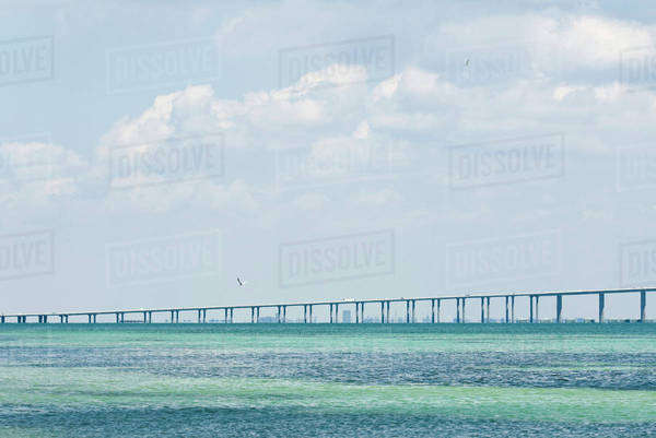 Bridge over ocean - Stock Photo - Dissolve
