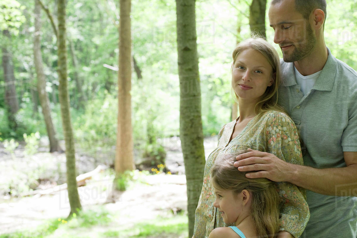 Family relaxing together in woods, portrait - Royalty-free Stock Photo ...