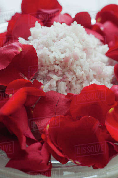Cooked rice decorated with red rose petals - Royalty-free Stock Photo ...