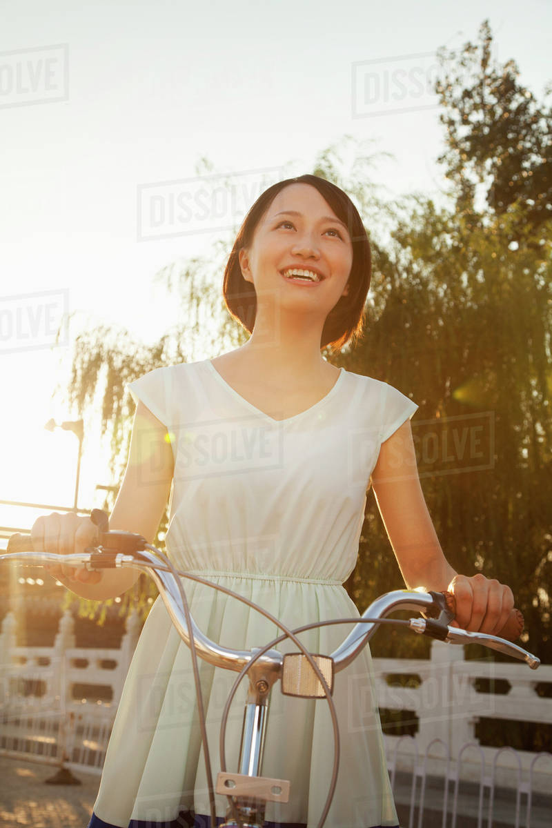 Young Woman on Bicycle - Royalty-free Stock Photo | Dissolve