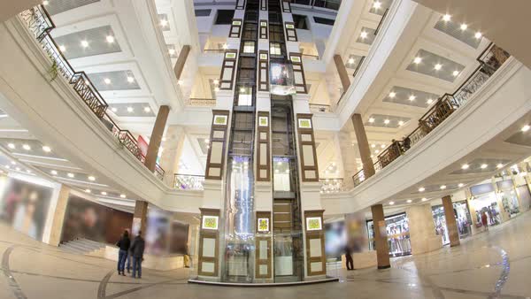 Motion elevators at the modern shopping mall timelapse hyperlapse. A ...