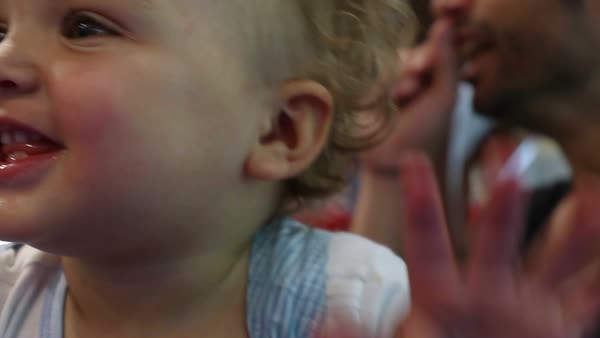 Toddler baby putting object inside mouth. Baby putting lens cap into ...