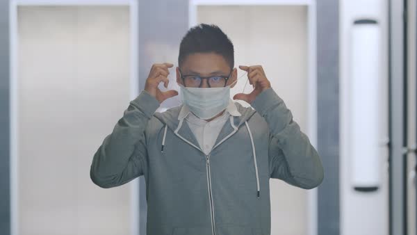 Coronavirus covid-19 outbreak protective measures. Office worker ...