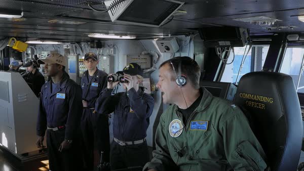 Tracking shot of a military submarine breaching surface - Stock Video ...