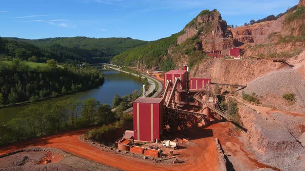 Rock quarry near road and river during the day - Stock Video Footage ...