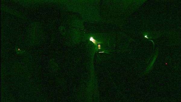 Night vision scene of a police officer talking on his radio - Stock ...