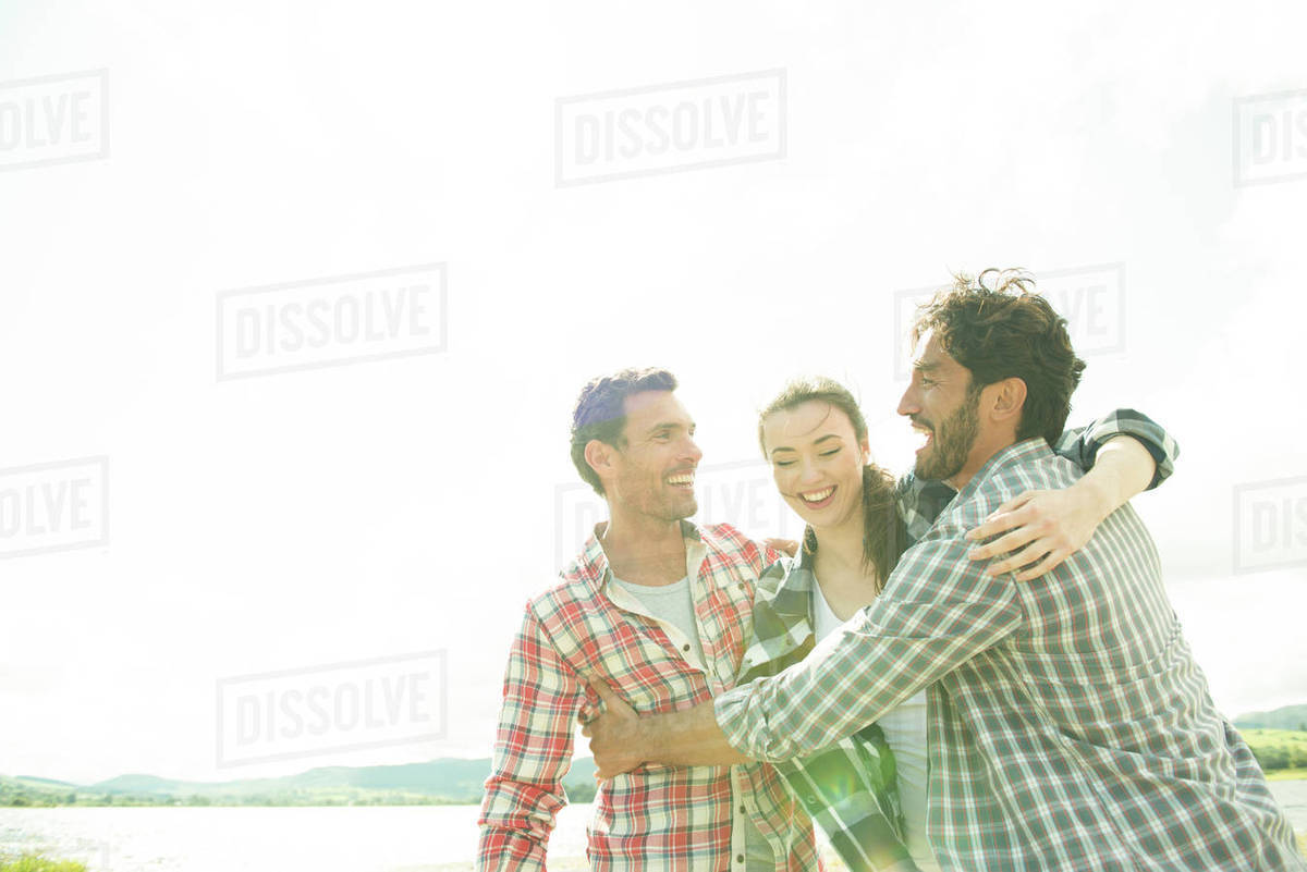 Three friends having fun on the shore of Bala Lake in Wales - Royalty ...