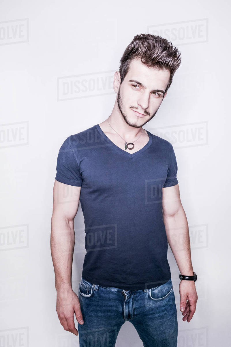 A young man posing in a studio looking cool - Royalty-free Stock Photo ...