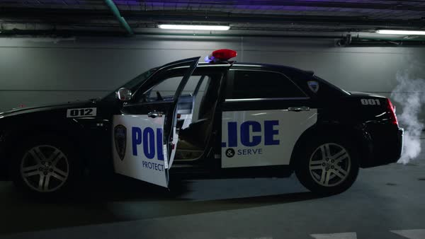 Police car parking at construction building. Patrol vehicle with open ...