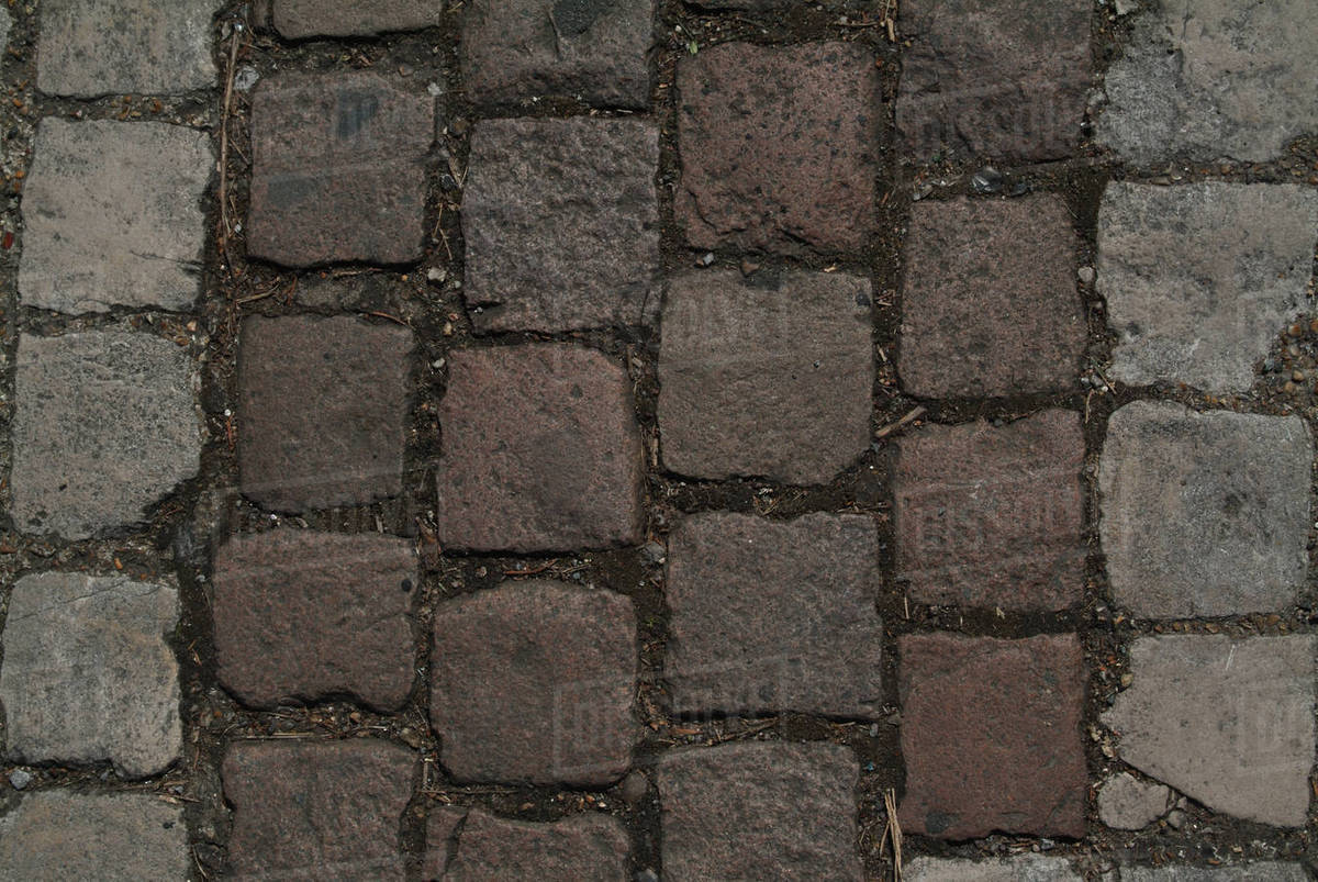 Close up of square grey paving blocks. - Stock Photo - Dissolve