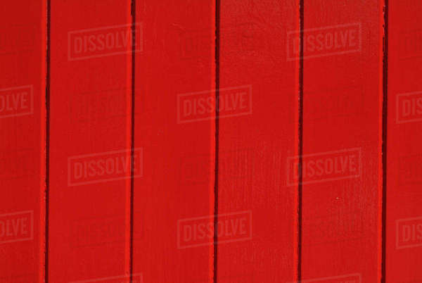 Close up of a red painted timber building. - Stock Photo - Dissolve