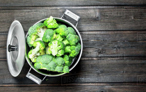 Broccoli in pot . On a wooden background. - Royalty-free Stock Photo ...