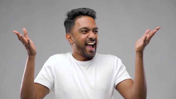 Confused indian man shrugging shoulders - 4K Royalty-free Stock Video ...