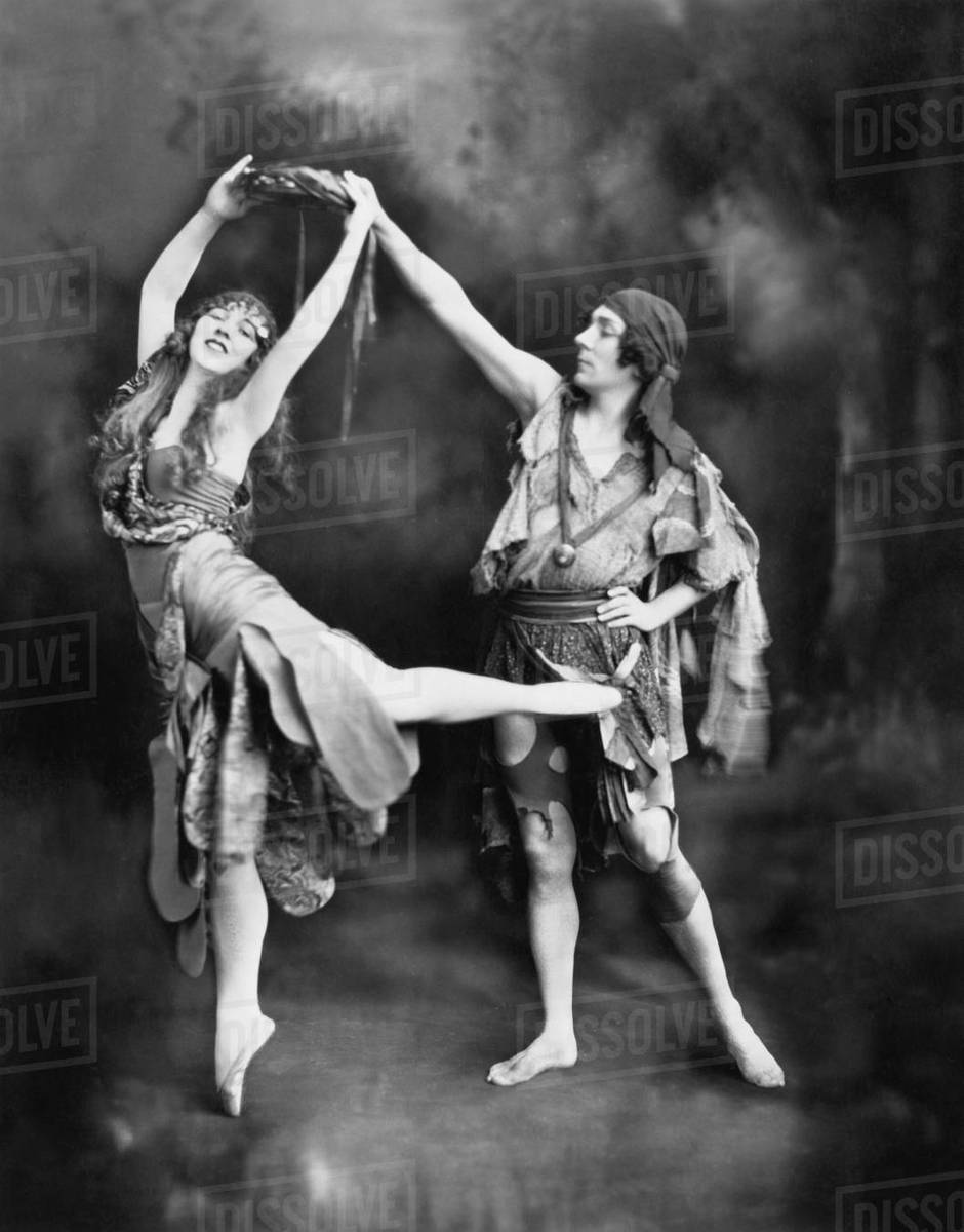 Male and female ballet dancers performing in costume - Royalty-free ...