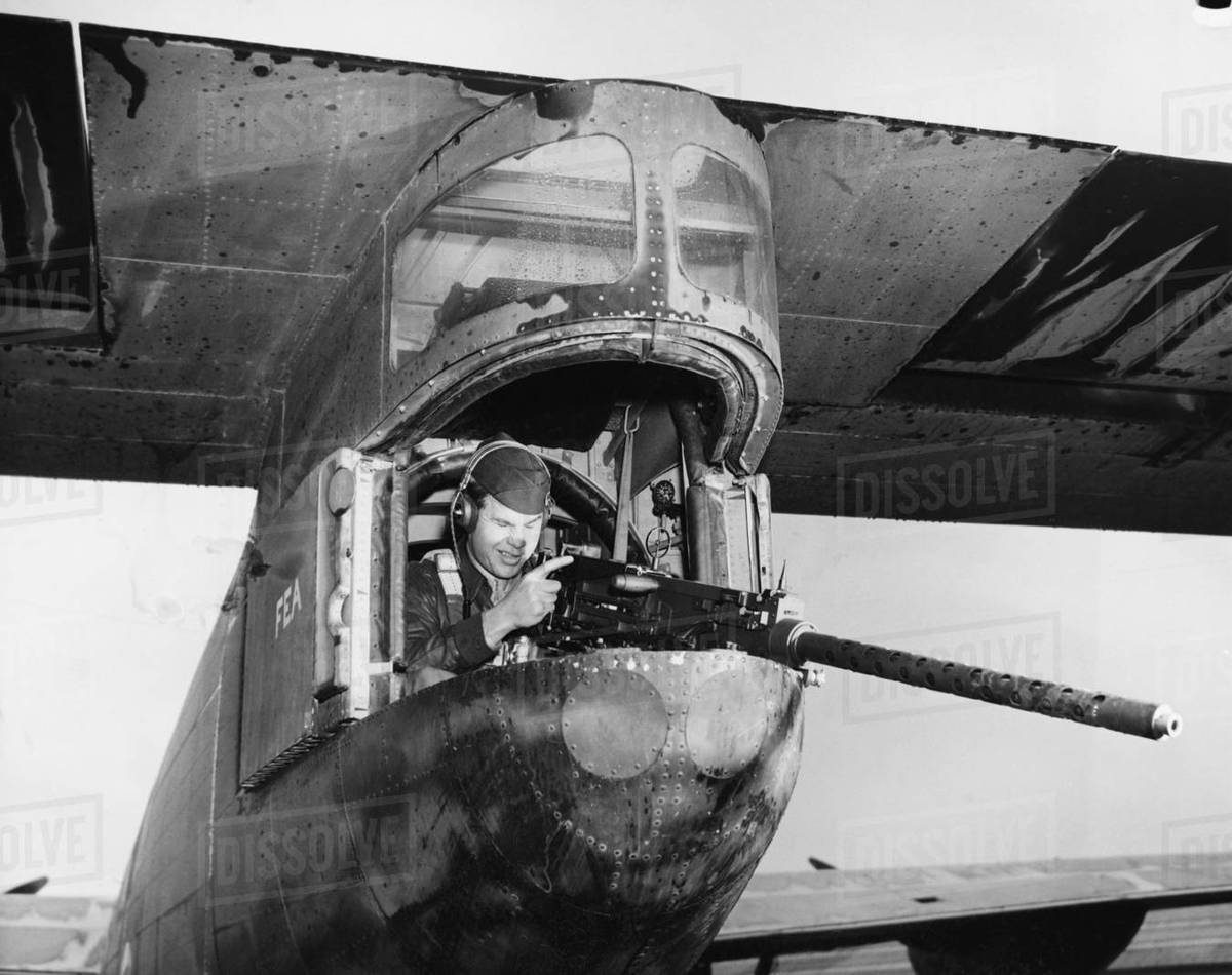 Gunner firing from plane - Stock Photo - Dissolve