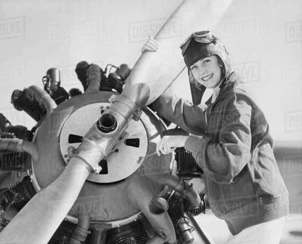 Portrait of woman with plane propeller - Stock Photo - Dissolve