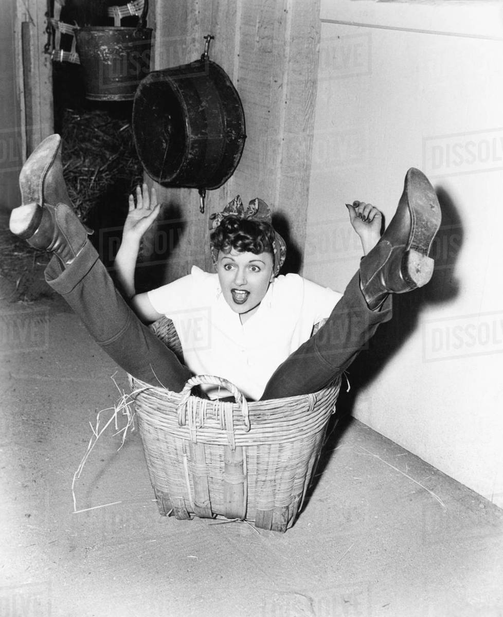 Woman falling into basket - Royalty-free Stock Photo | Dissolve