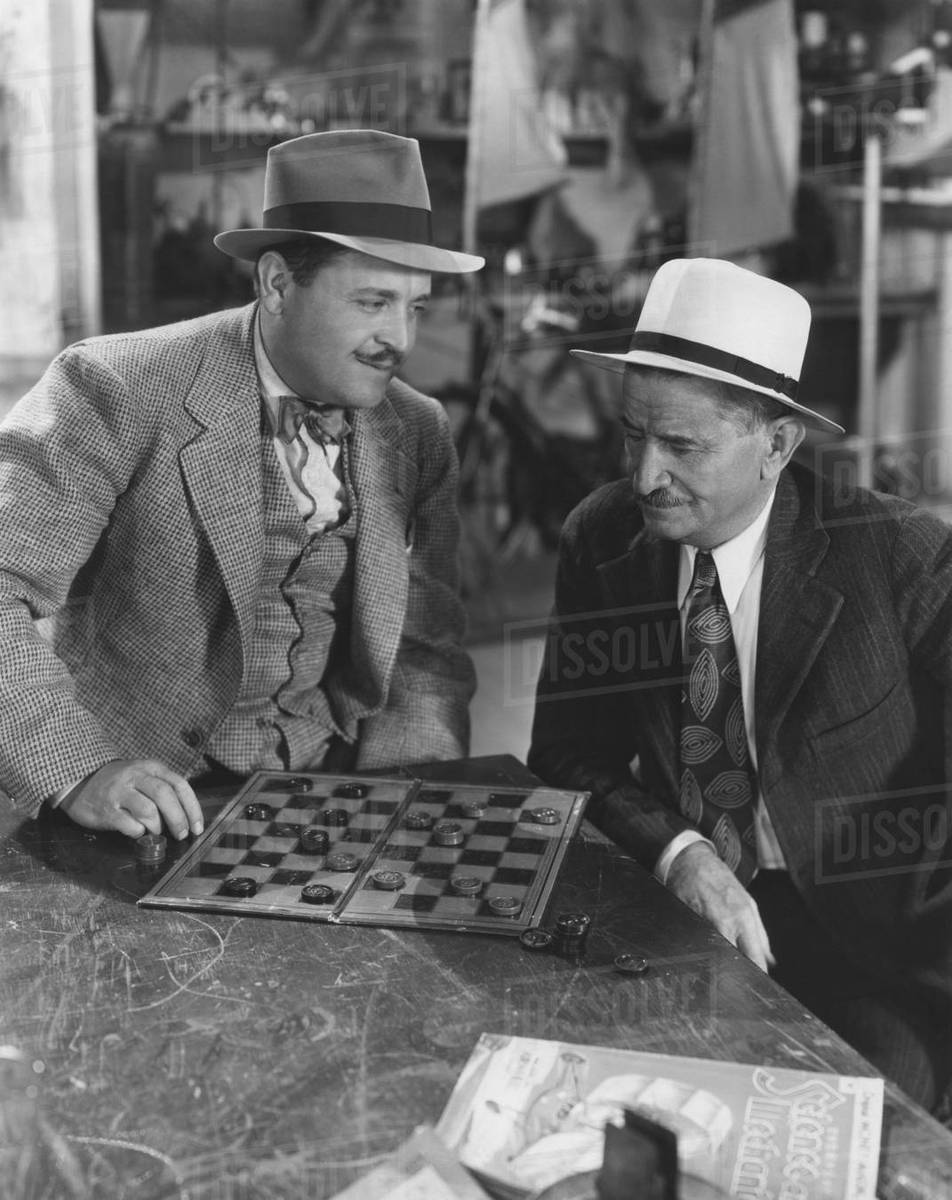 Game of checkers - Stock Photo - Dissolve