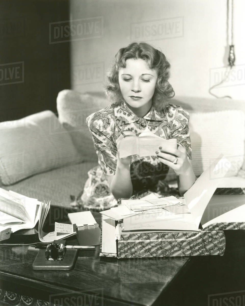 Going over the bills - Royalty-free Stock Photo | Dissolve