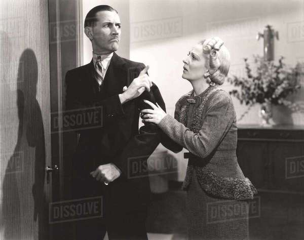 Persistent woman pleading with angry man - Royalty-free Stock Photo ...