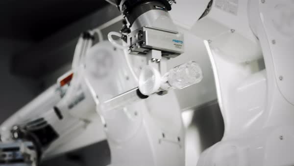 The innovative arms of a robotic arm make an injection of chemotherapy ...