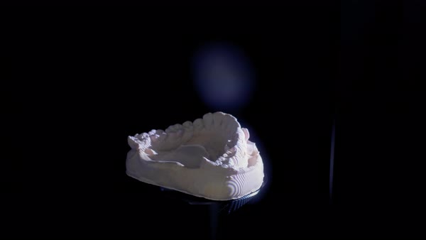 Dental prosthetic restoration. Denturist is making 3D model for ...