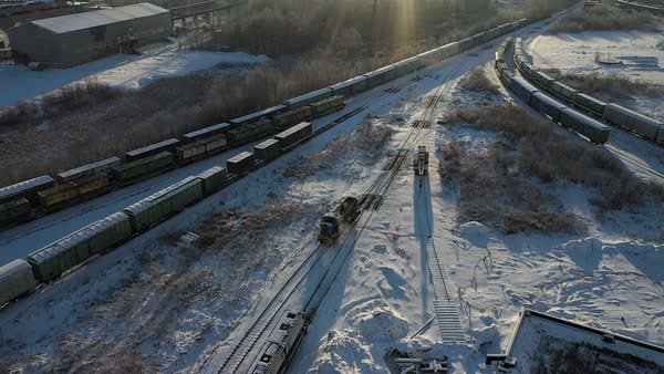 Freight trains on the railway in winter - Stock Video Footage - Dissolve