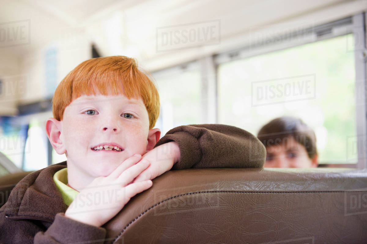 Children riding school bus - Royalty-free Stock Photo | Dissolve