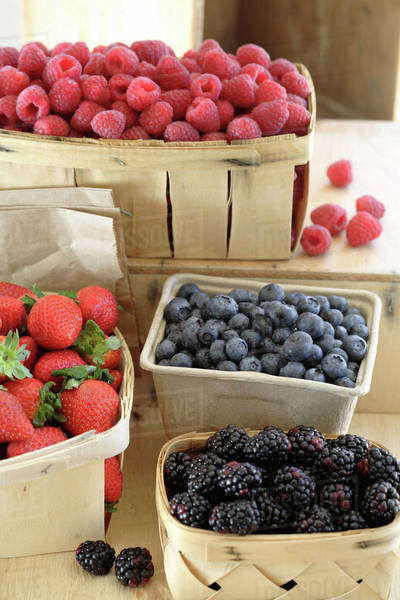 Various fresh berries in baskets - Royalty-free Stock Photo | Dissolve