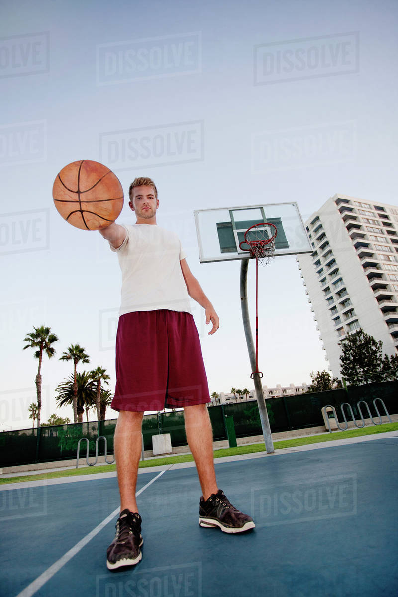 Caucasian man standing on basketball court - Royalty-free Stock Photo ...