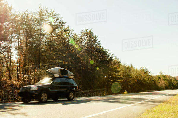 Car driving on rural road - Royalty-free Stock Photo | Dissolve