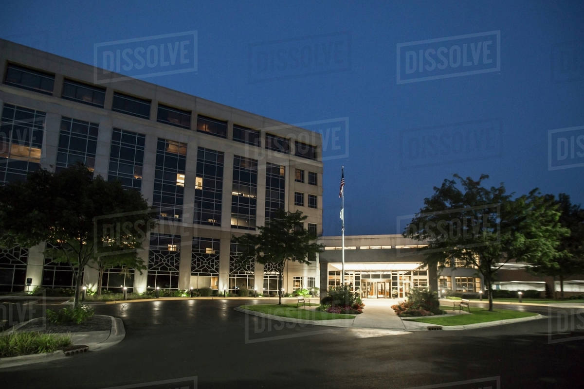 Illuminated driveway of hospital at night - Royalty-free Stock Photo ...
