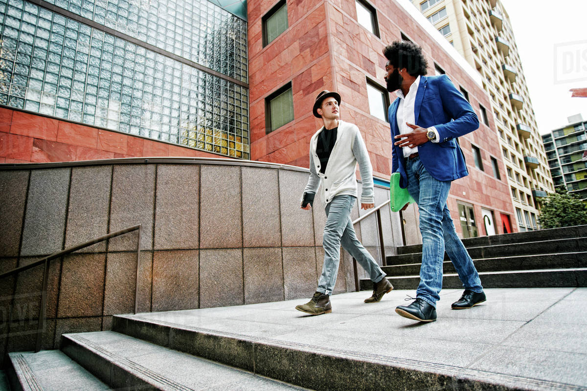 Businessmen talking on steps - Royalty-free Stock Photo | Dissolve